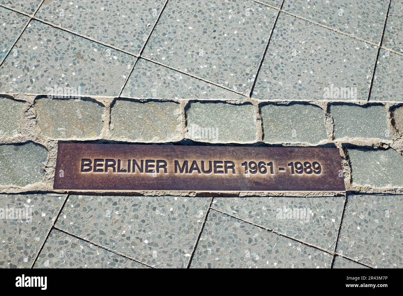 Berlin Wall memorial plaque marking the former course of the Wall Stock ...