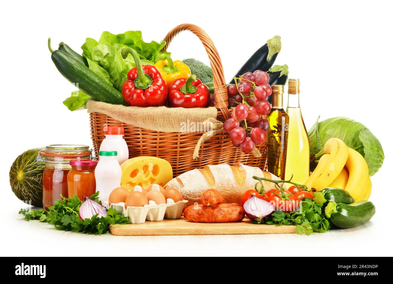 Assorted grocery products including vegetables fruits wine bread dairy ...
