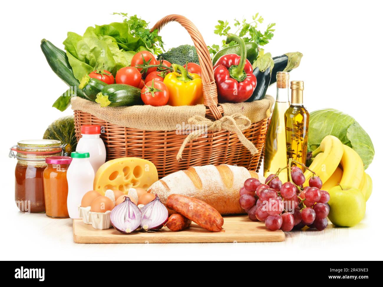 Assorted grocery products including vegetables fruits wine bread dairy ...