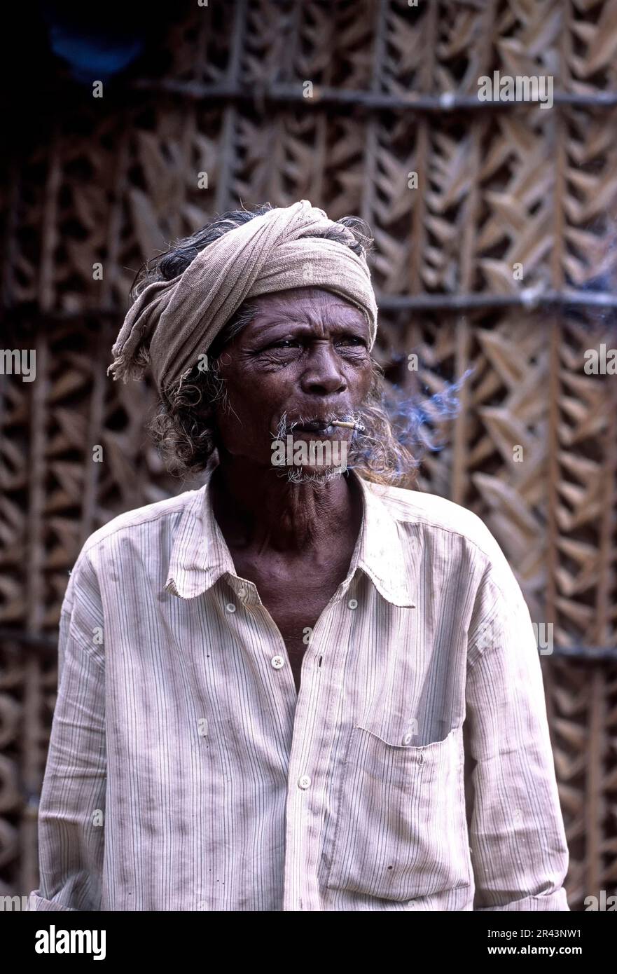 Tribal man smoking beedi, Anaikatti near Coimbatore, Tamil Nadu, India ...