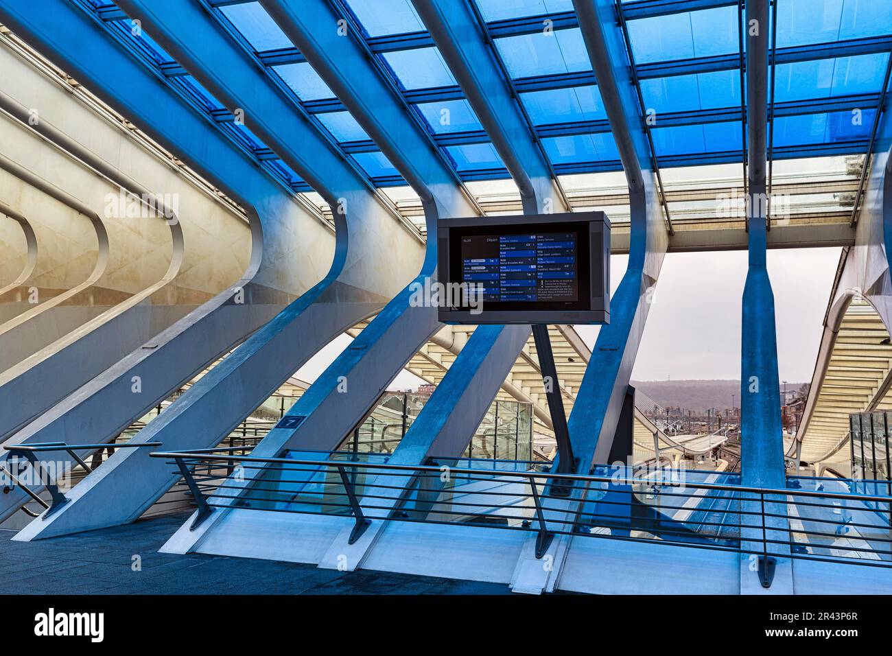 Digital display board with train departure times, screen under roof ...