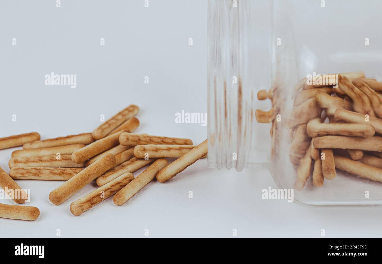 pile of Biscuit sticks in a glass jar on a white background Stock Photo ...