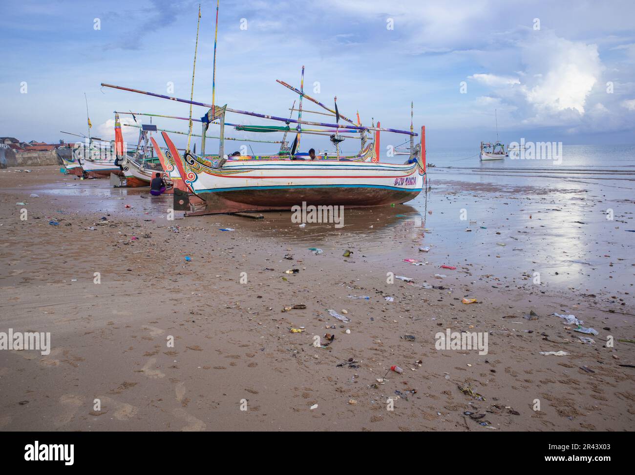Fishing boats parked on the beach to be repaired and repainted. the ...