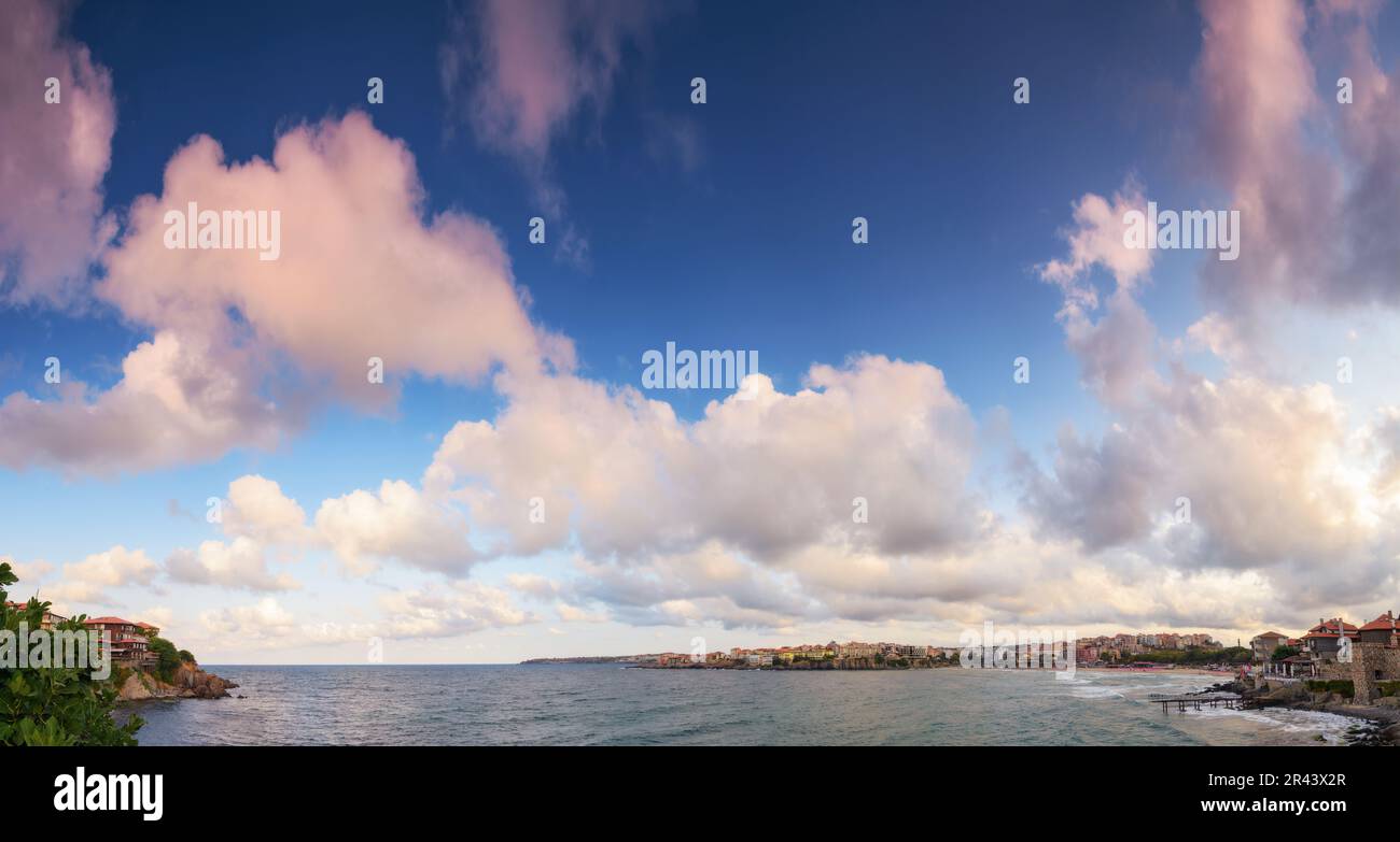 panorama with fluffy clouds on a blue sky in evening light. beautiful ...
