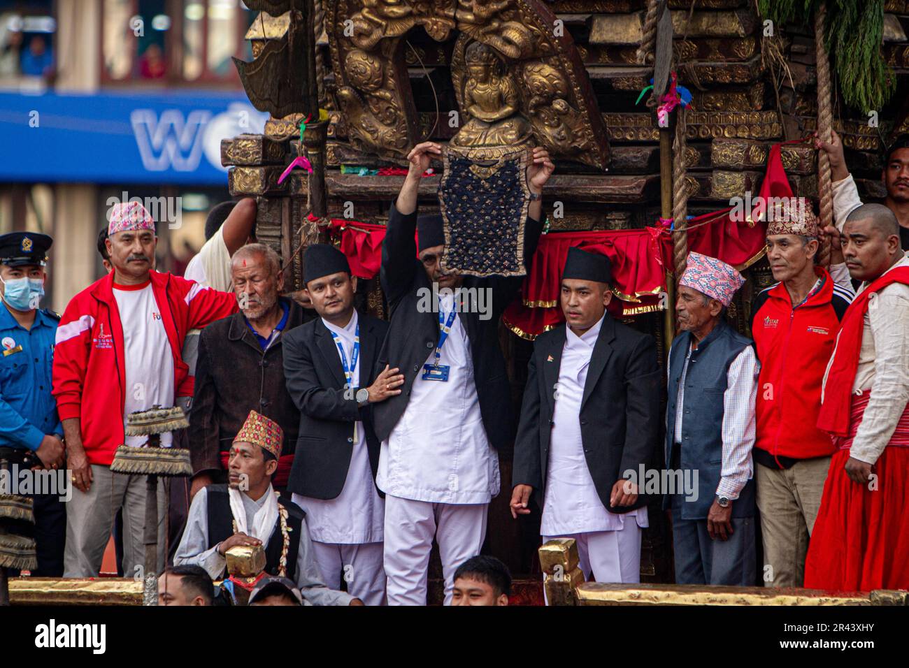 A Nepalese Guthi Sansthan member displaying the black jewel-studded ...