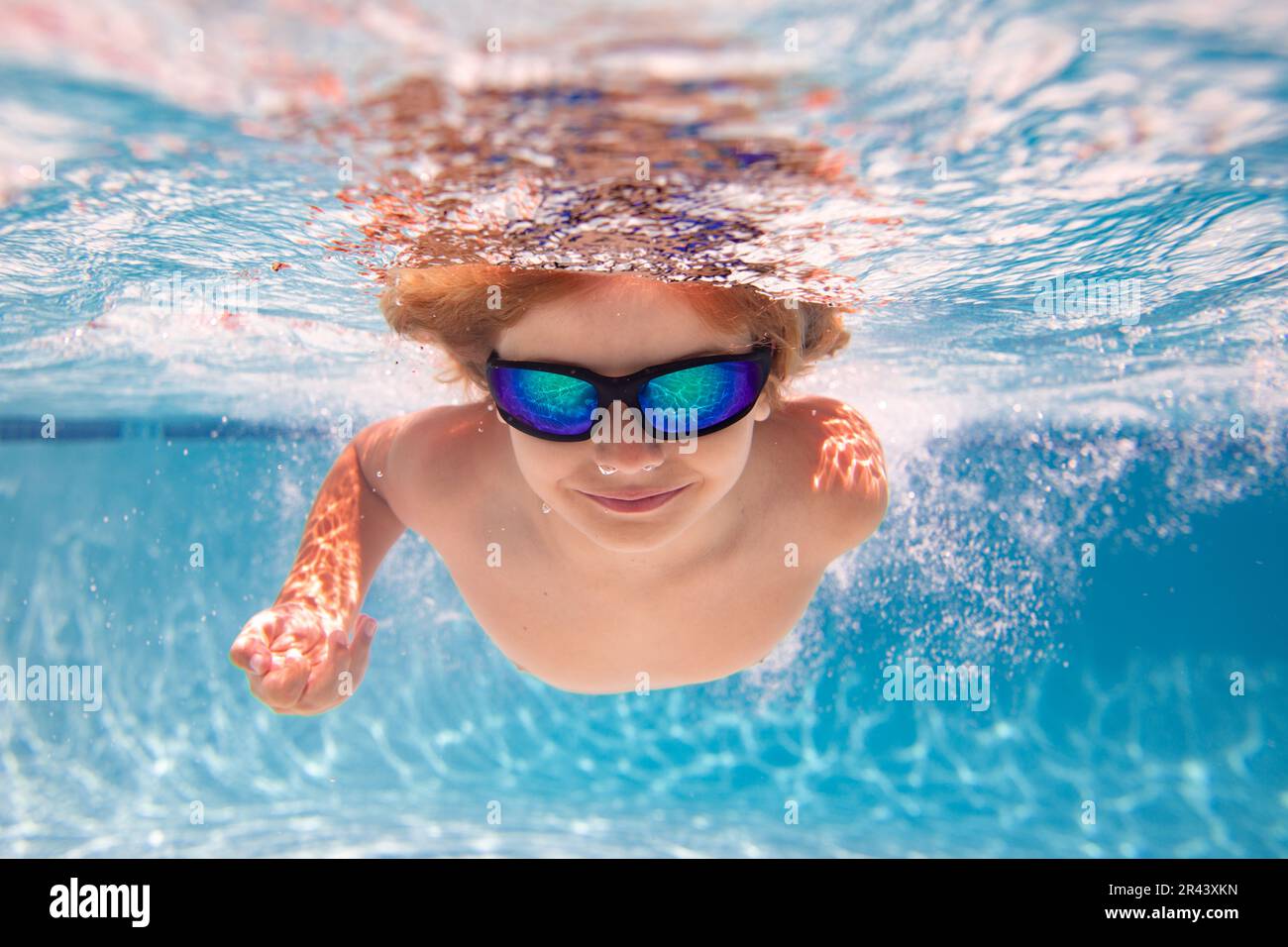 Little Kids Swimming Underwater