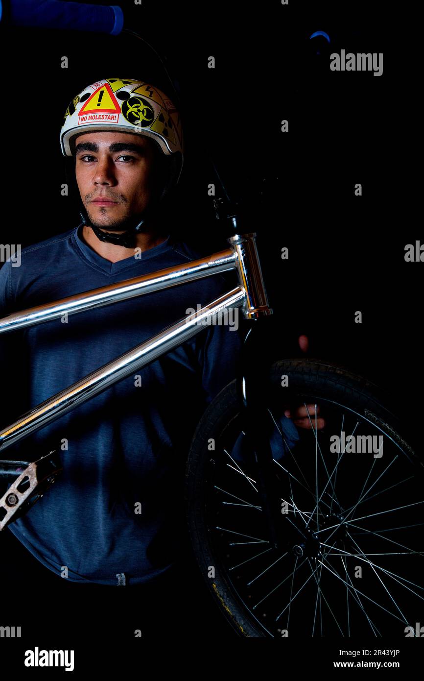 Portrait of a young latin boy sitting with his BMX bike Stock Photo - Alamy