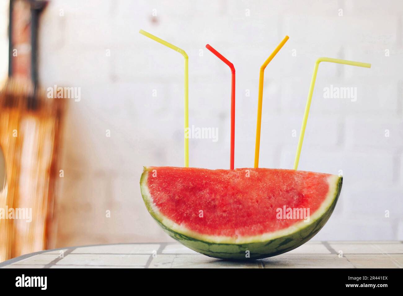Watermelon slice with straws on a white background Stock Photo - Alamy