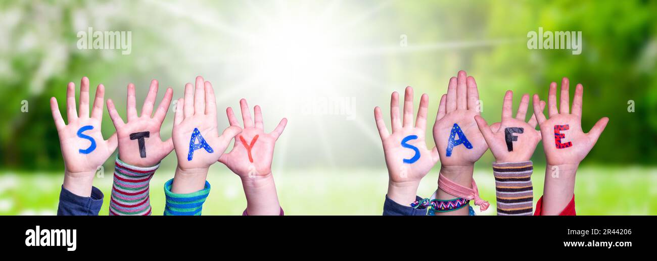 Children Hands Building Word Stay Safe, Grass Meadow Stock Photo - Alamy