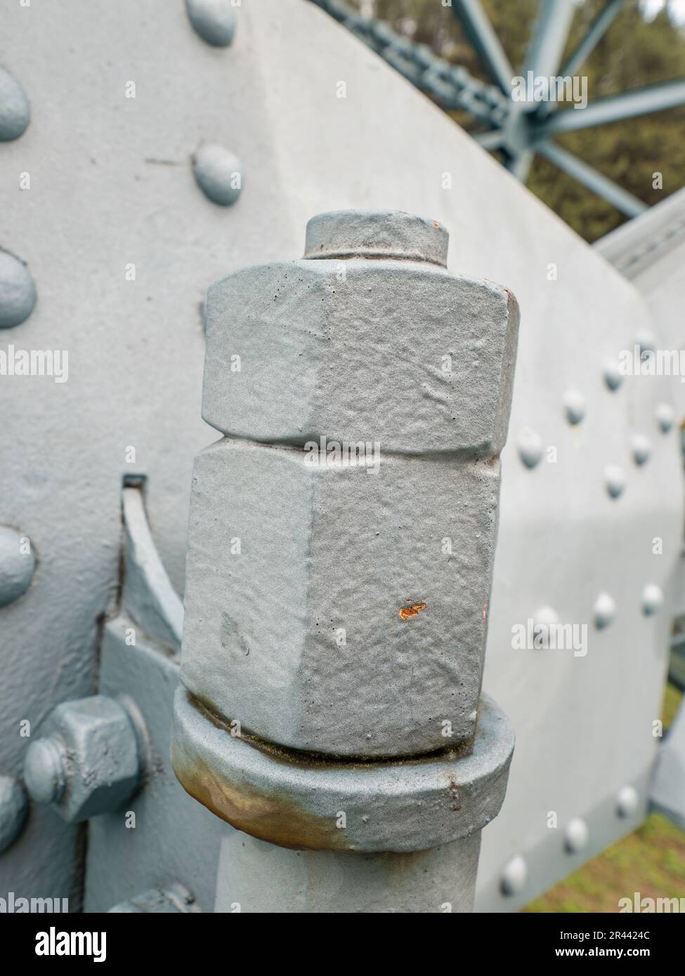 Bolts screwed into the old metal construction. Part of bridge ...