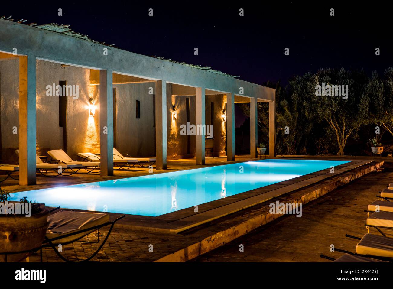 Night scene with dreamlike tropical pool Stock Photo - Alamy