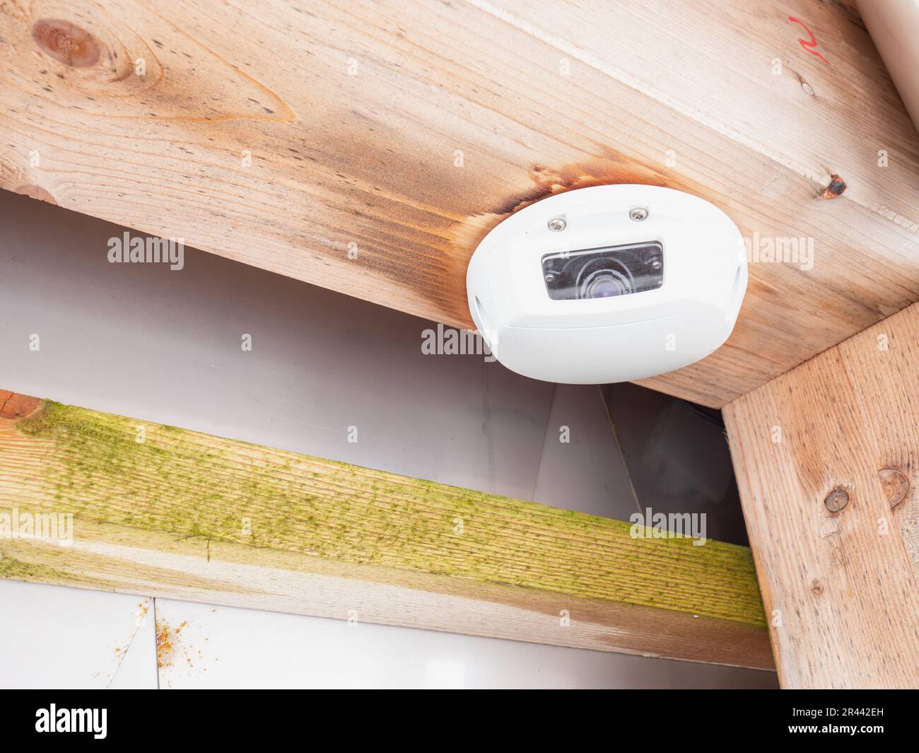 Surveillance camera inside the room on the wall, close view. CCTV ...