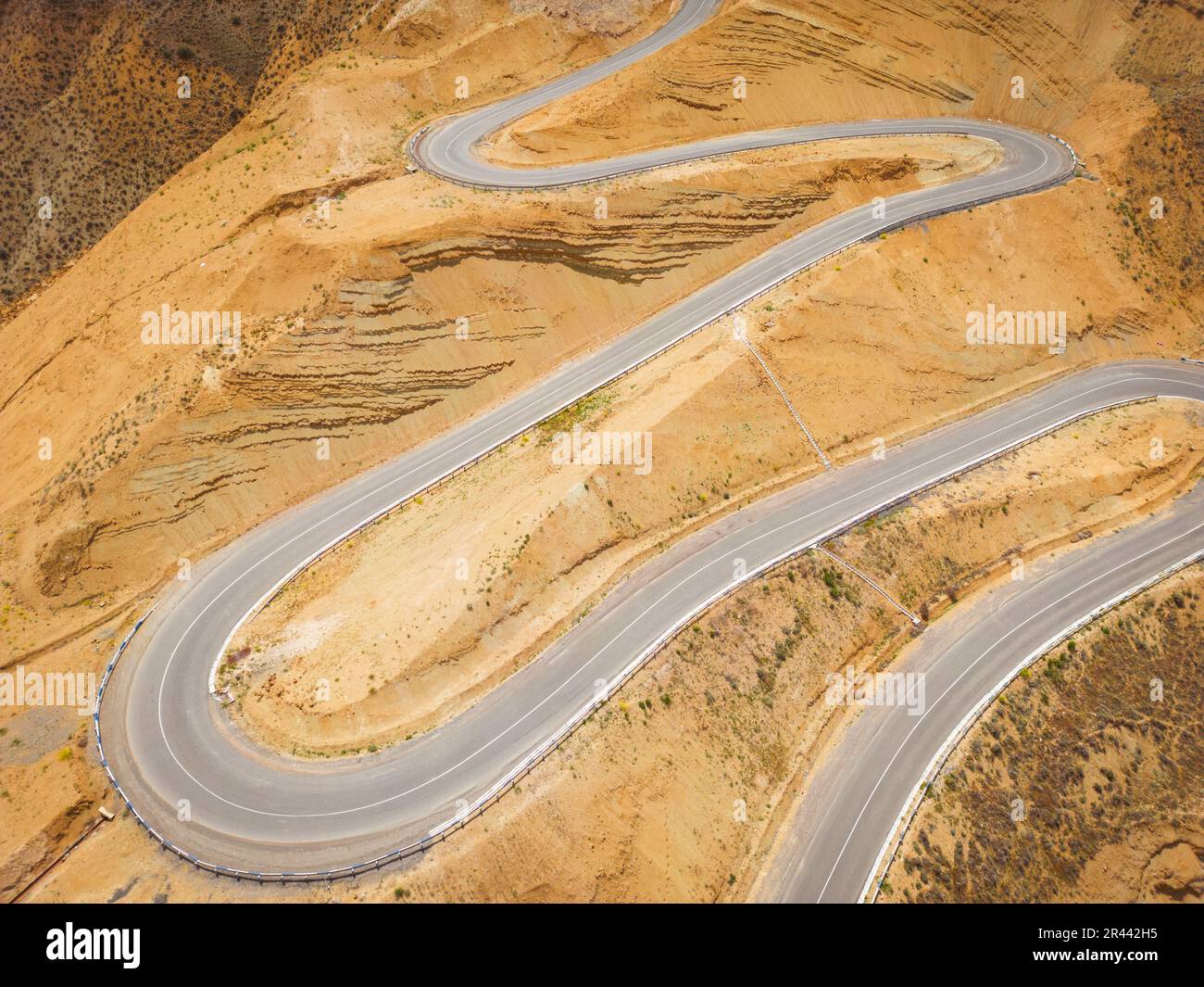 Top aerial view of snake curved road. Winding mountains road. View from ...