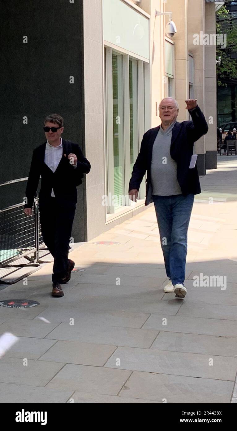 Graham Johnson (left) and John Cleese arrive at the Rolls Buildings in ...