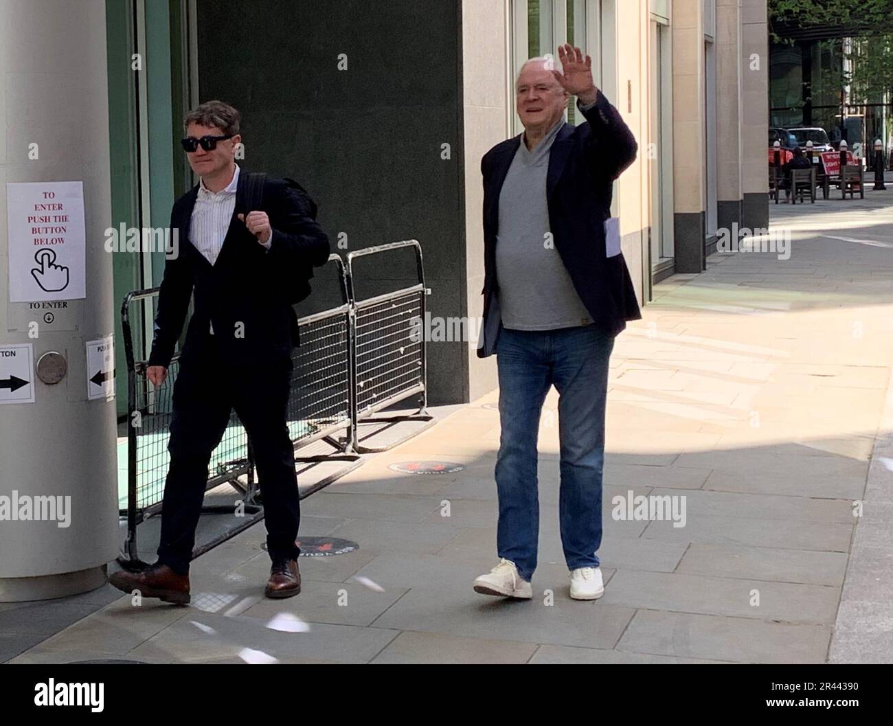 Graham Johnson (left) and John Cleese arrive at the Rolls Buildings in ...