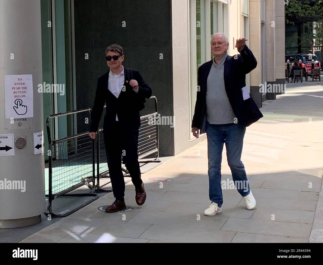 Graham Johnson (left) and John Cleese arrive at the Rolls Buildings in ...