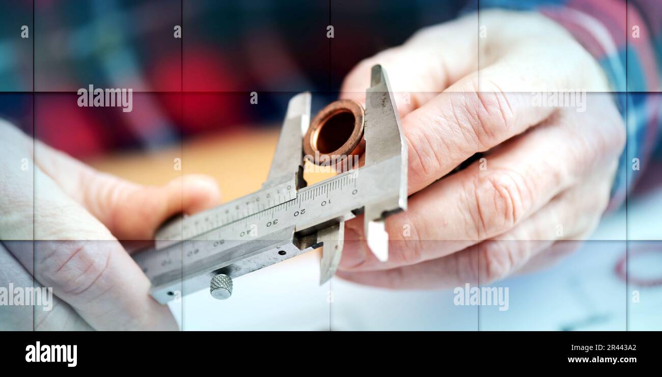 Plumber measuring a copper tube with a caliper, geometric pattern Stock ...