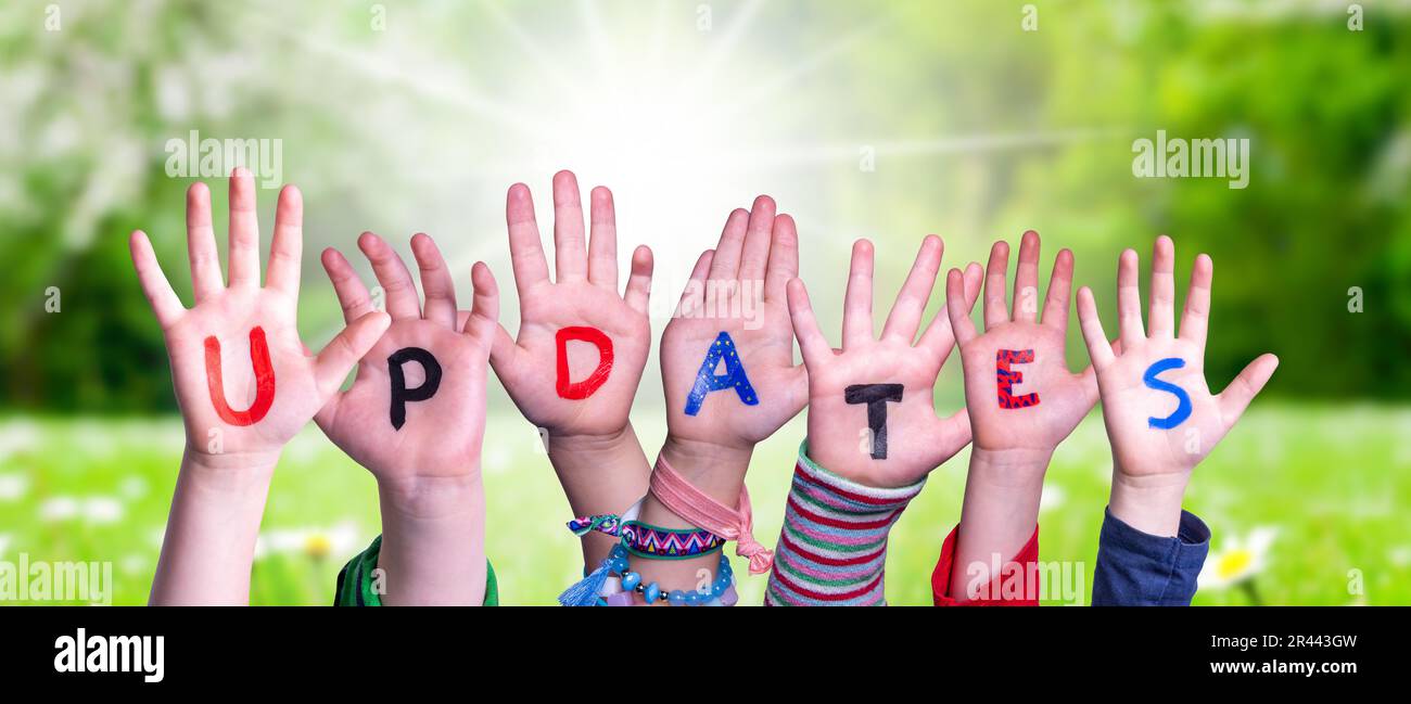 Children Hands Building Word Updates, Grass Meadow Stock Photo - Alamy