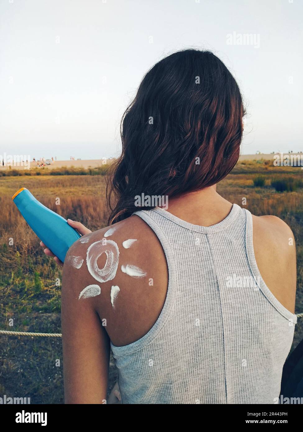 Woman sun cream park hi-res stock photography and images - Alamy