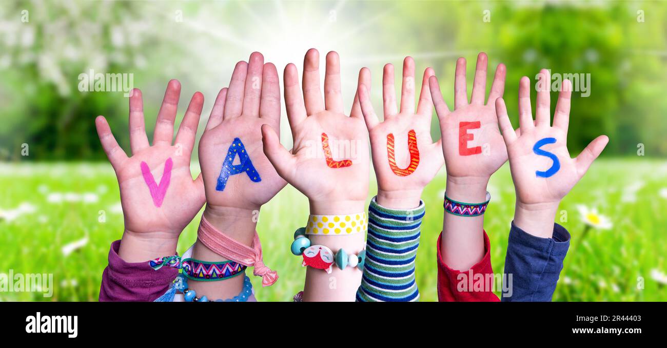 Children Hands Building Word Values, Grass Meadow Stock Photo - Alamy