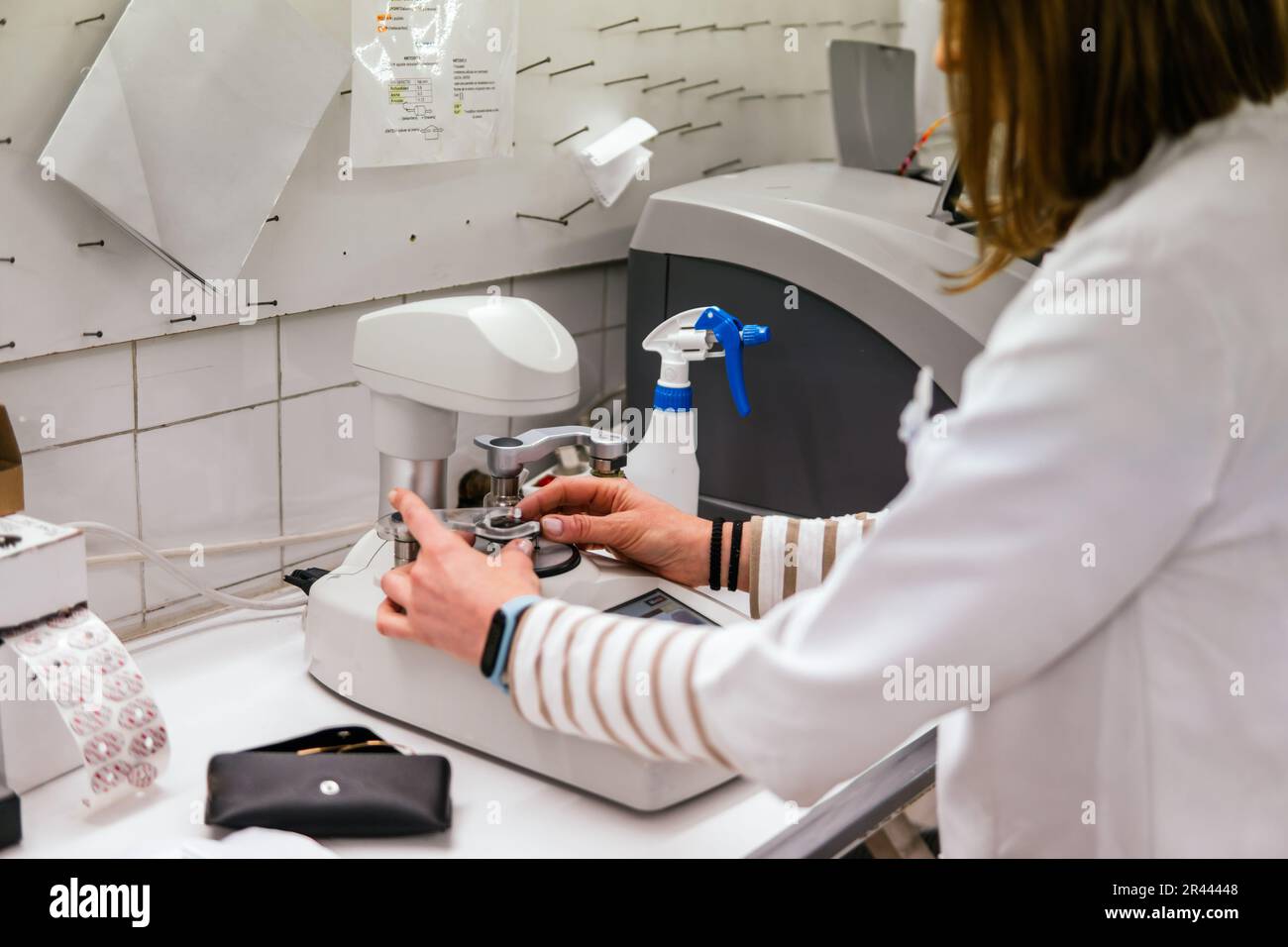 optician cutting glasses glass in an optician's workshop Stock Photo ...