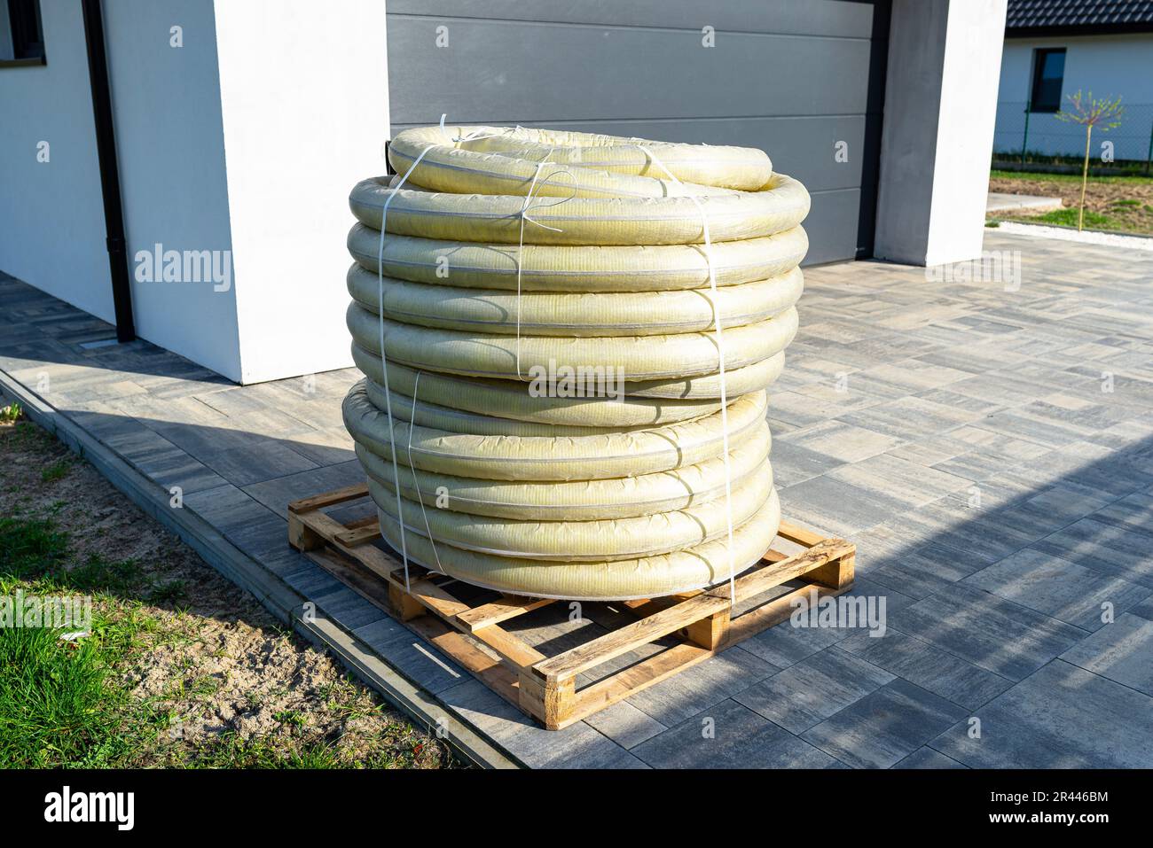 Coiled drainage pipe lying on a pallet in the yard Stock Photo - Alamy