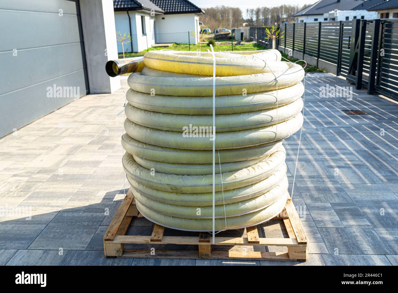 Coiled drainage pipe lying on a pallet in the yard Stock Photo - Alamy