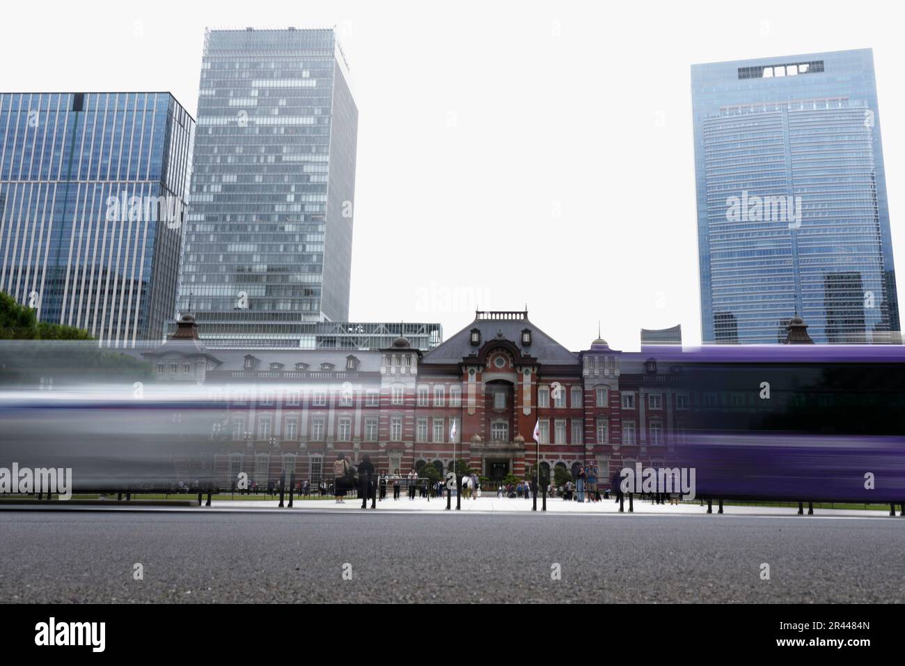 Vehicles pass by the Tokyo Station Friday, May 26, 2023, in Tokyo. Tokyo Station is one of ...