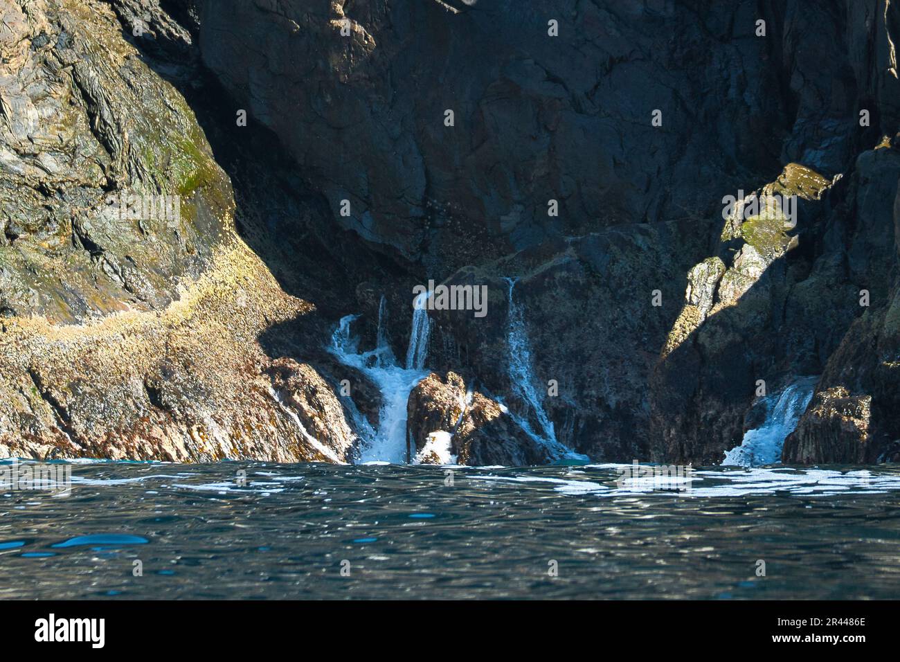 norway on the fjord, spray on rocks. Water splashes on the stones ...