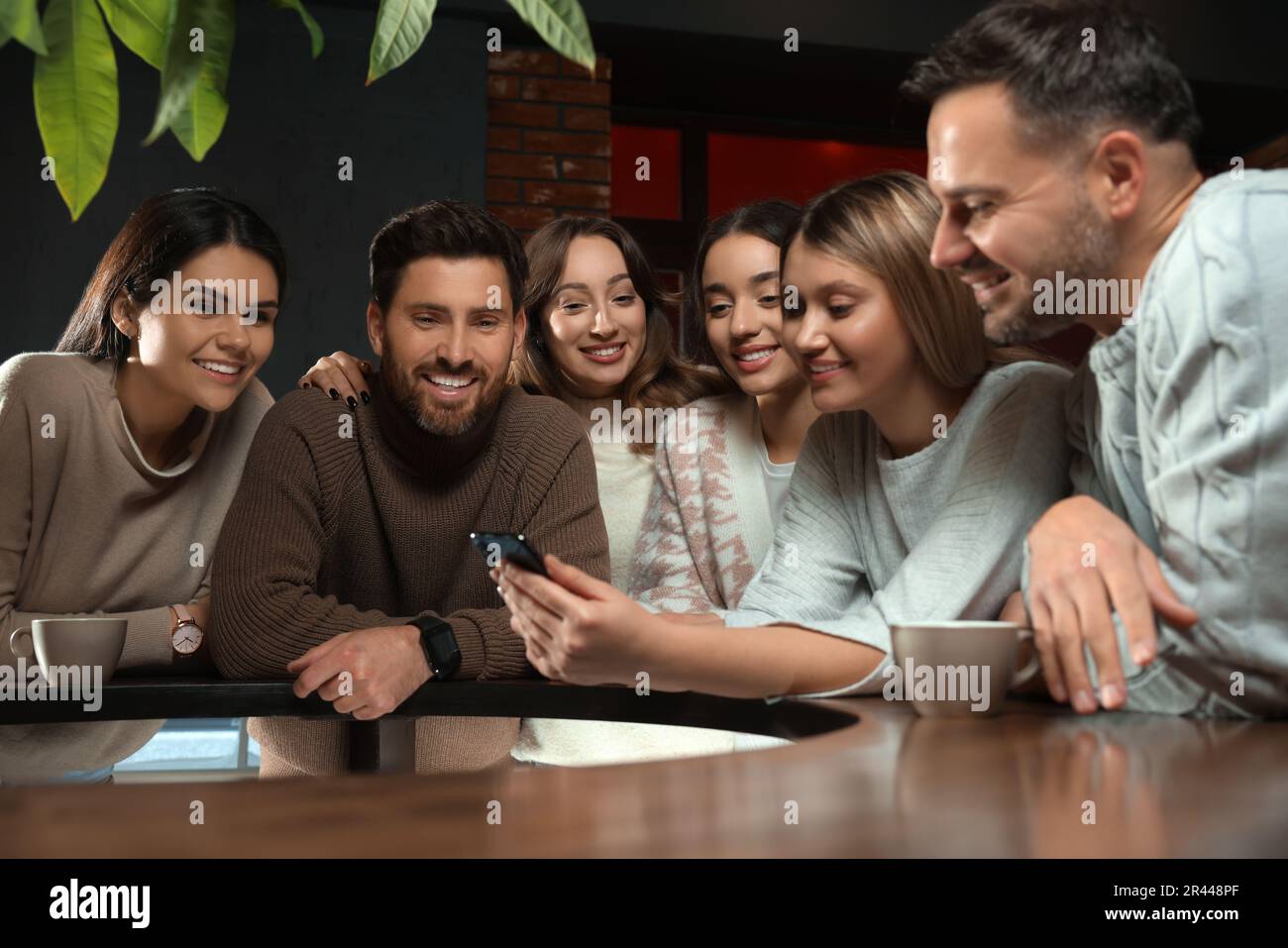 Woman showing something funny hi-res stock photography and images - Alamy