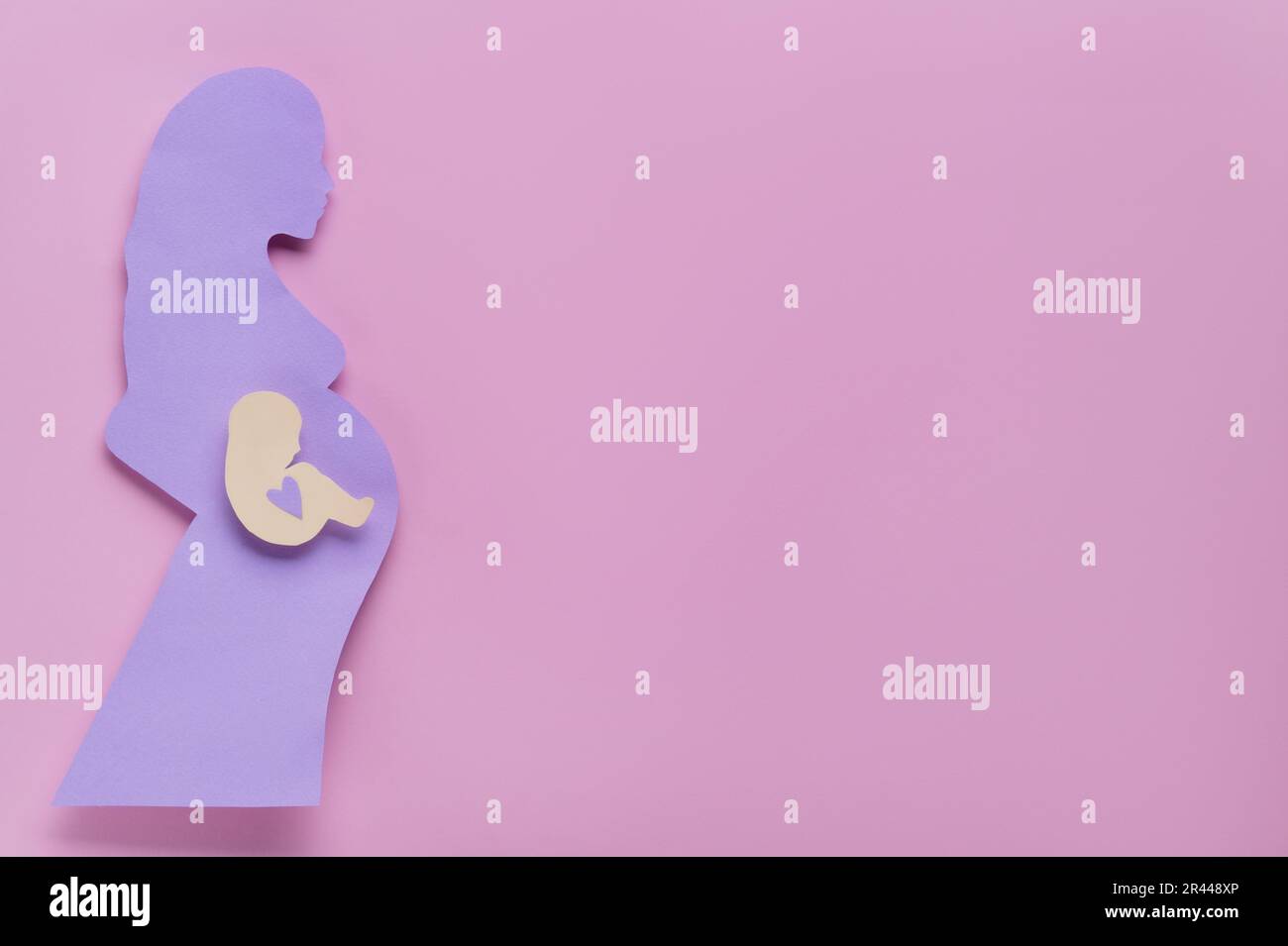 Woman`s health. Pregnant woman with baby on pale pink background, top ...