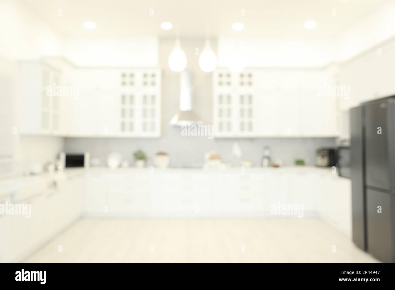 Blurred view of modern kitchen. Interior design Stock Photo - Alamy