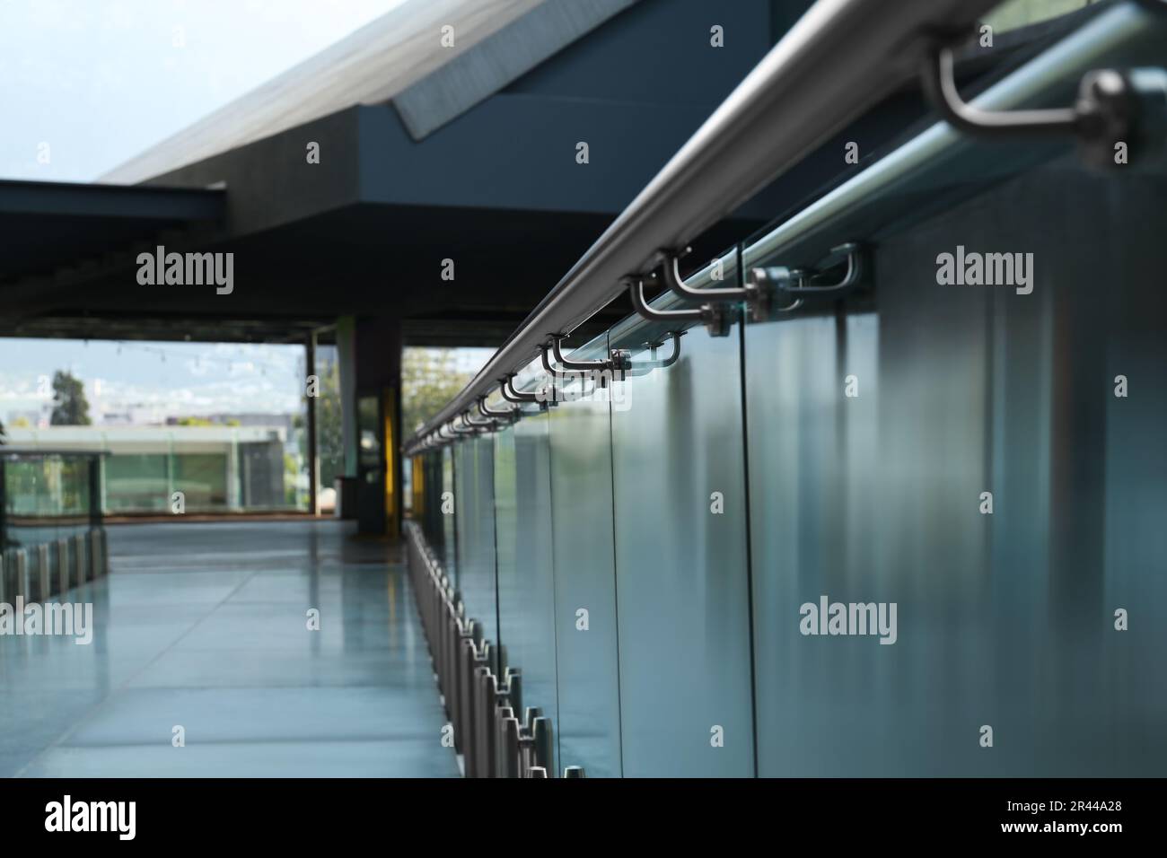 Glass barrier with metal handrail in modern building, closeup Stock ...