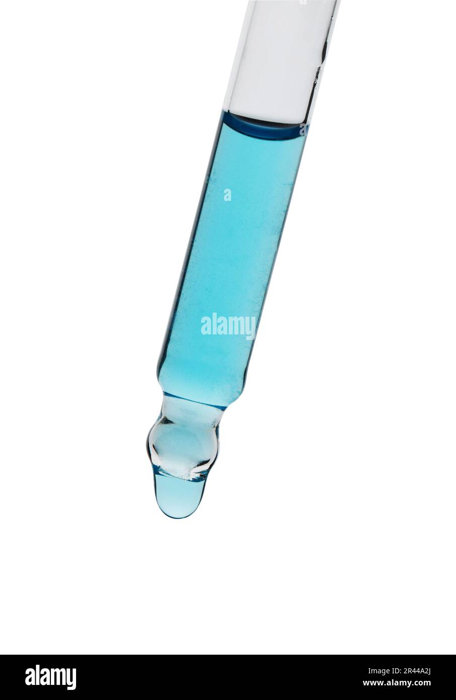 Dripping light blue facial serum from pipette on white background ...