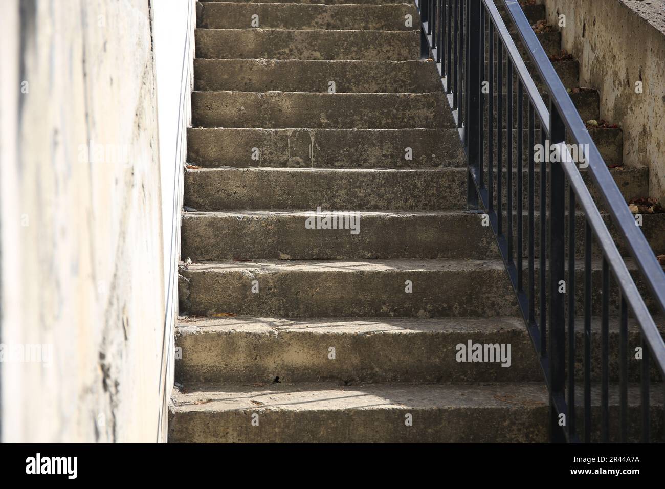 View of beautiful concrete stairs with metal handrail outdoors Stock ...