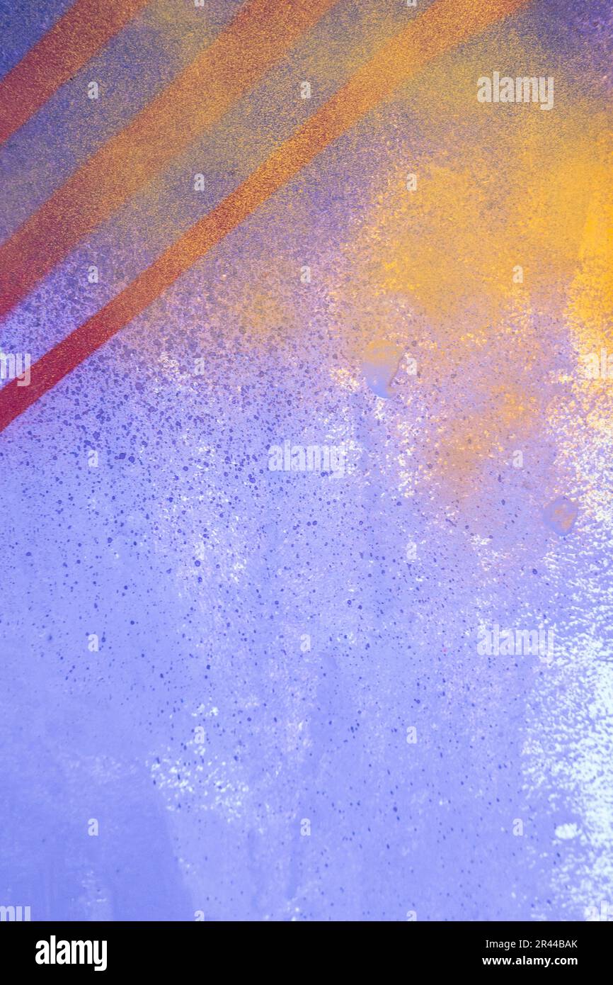 Messy paint strokes and smudges on an old painted wall. Purple, blue ...