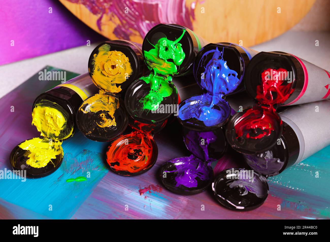 Tubes of colorful paints and canvas on table, closeup Stock Photo - Alamy