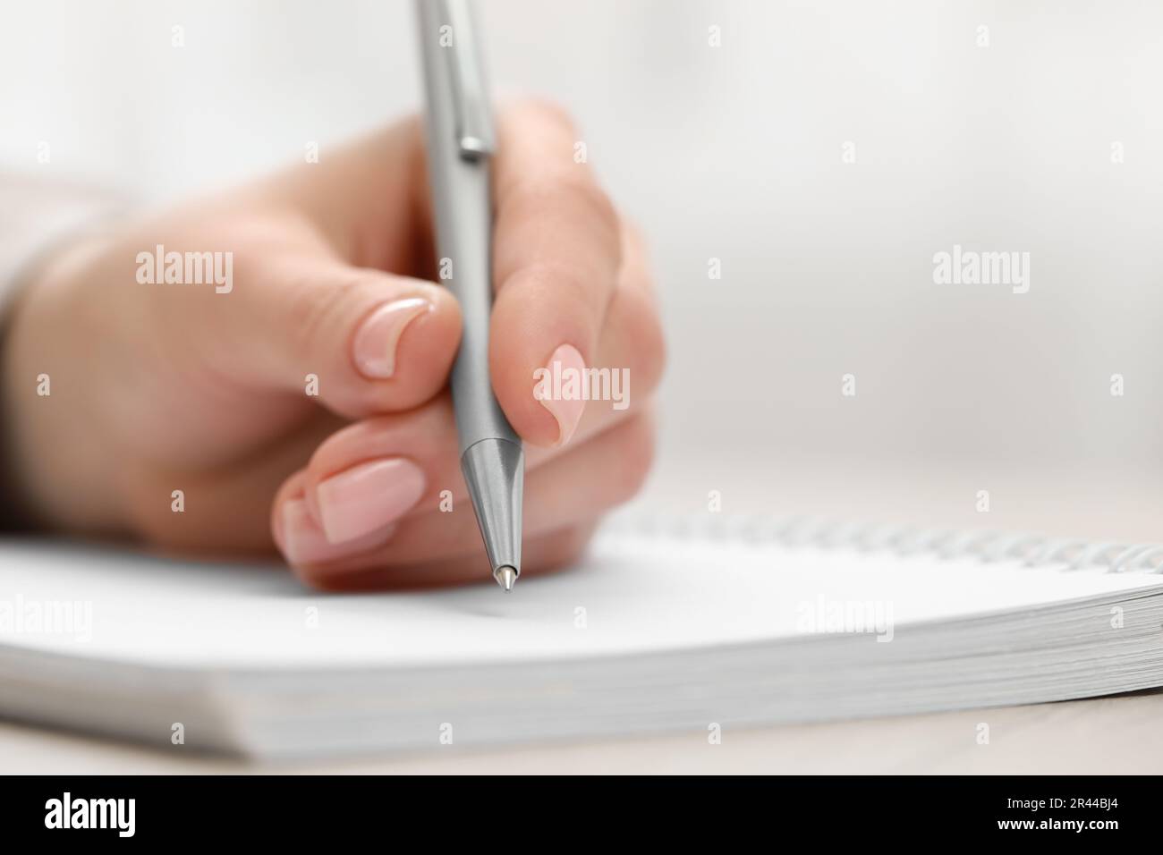 Woman writing pen in hi-res stock photography and images - Alamy