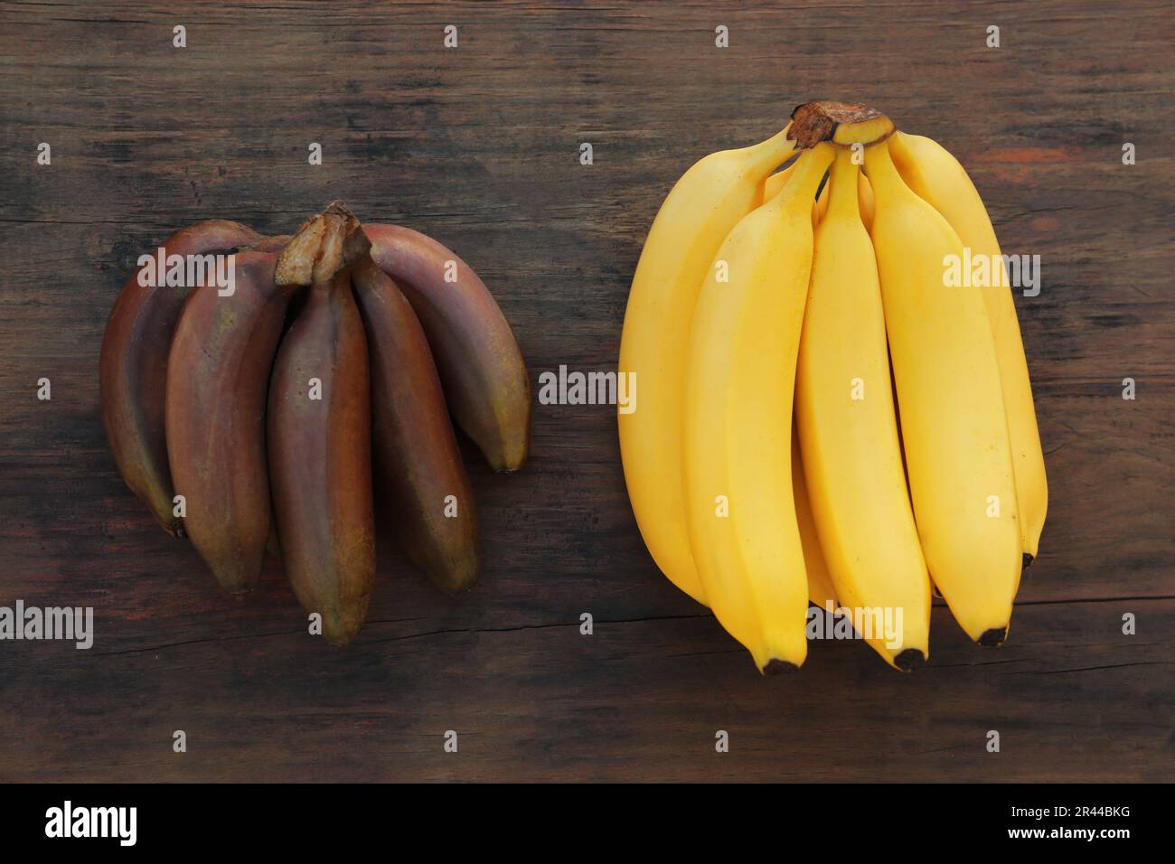 Different types of bananas on wooden table, flat lay Stock Photo - Alamy