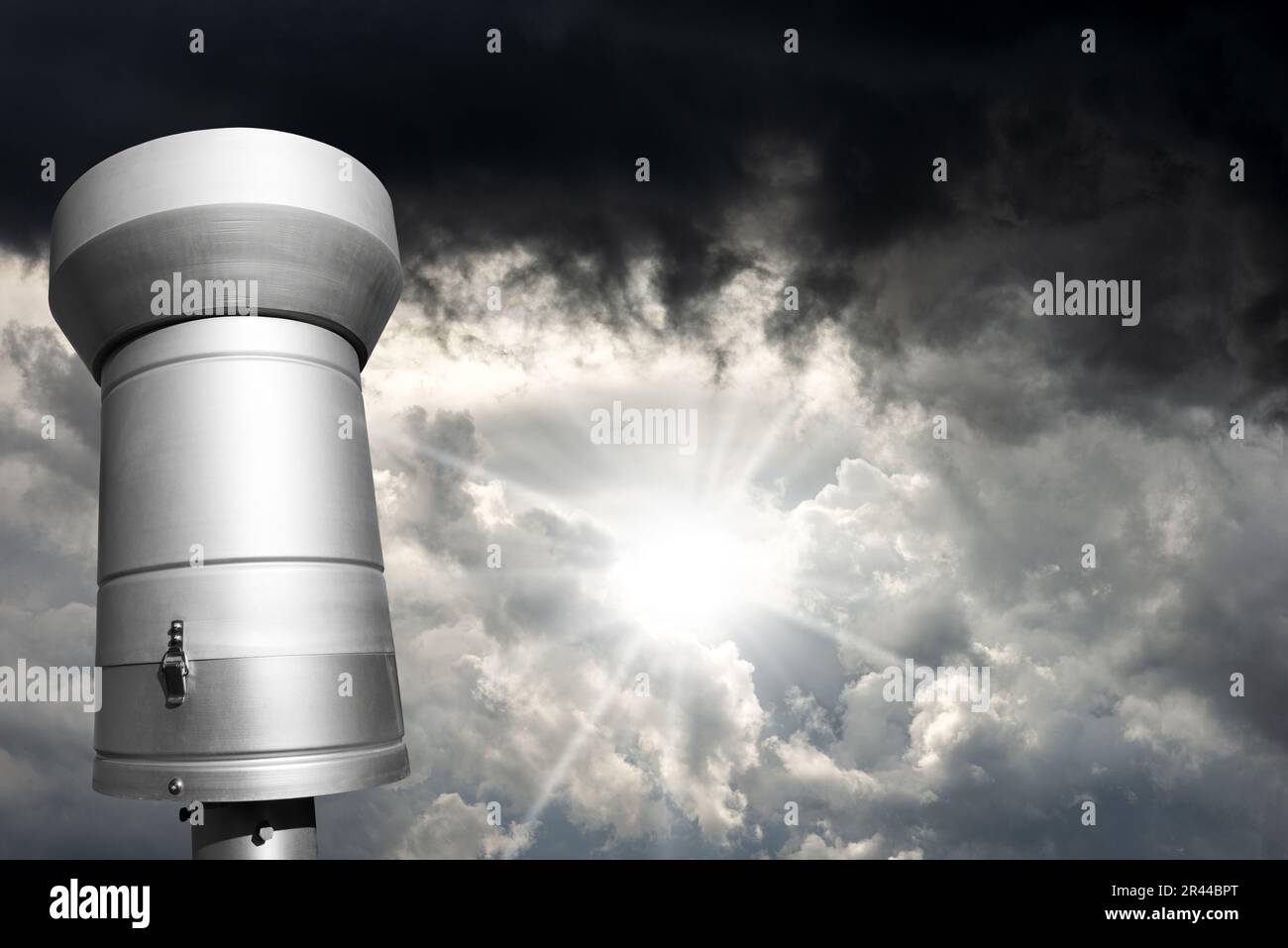Closeup of a weather station with a metallic rain gauge or pluviometer ... Closeup of a weather station with a metallic rain gauge or pluviometer ...