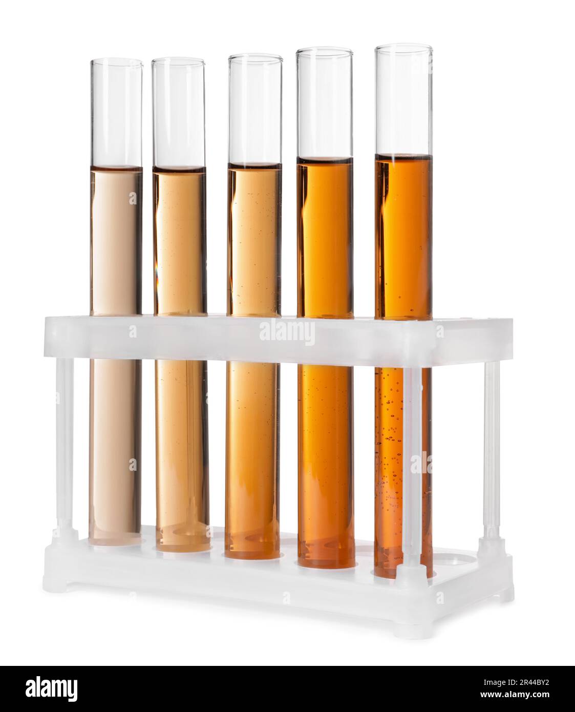 Test tubes with brown liquid in stand on white background Stock Photo ...