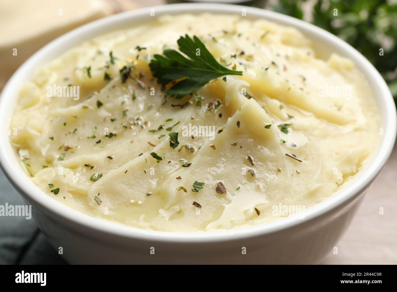 Bowl of delicious mashed potato with parsley, closeup Stock Photo - Alamy