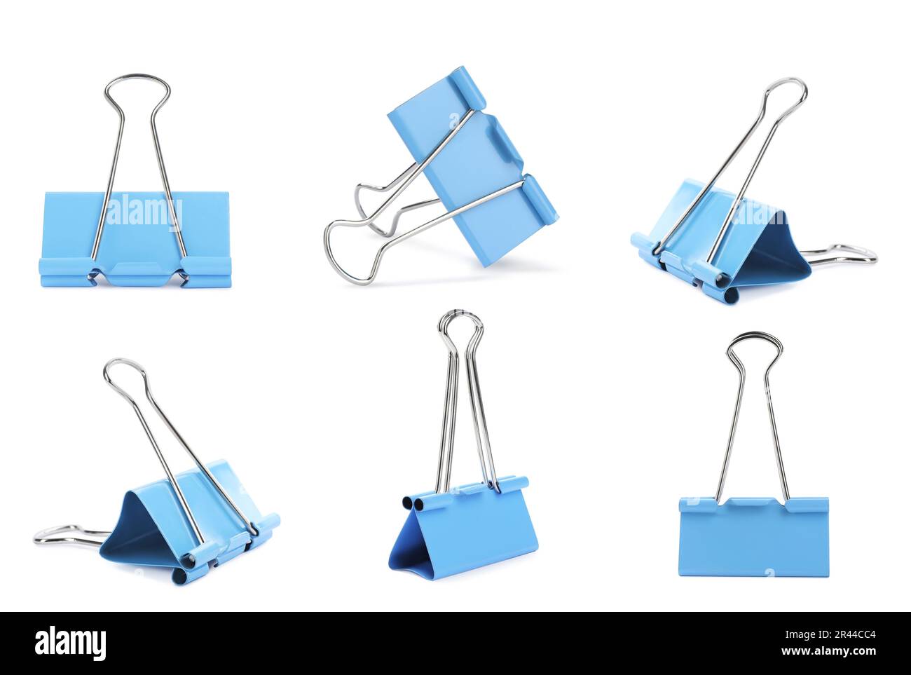 Set with light blue binder clips on white background Stock Photo - Alamy