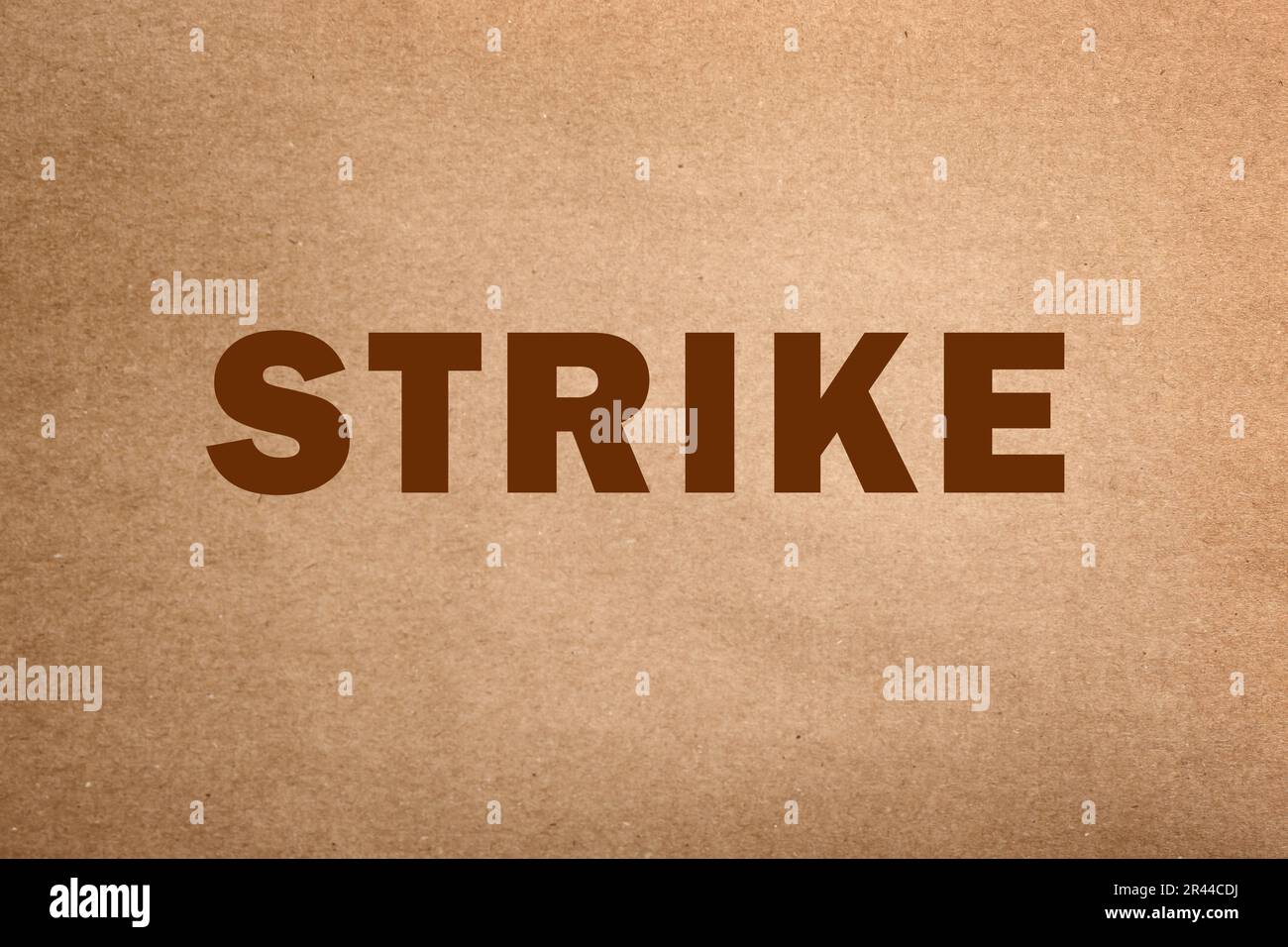 Protest concept. Word Strike on kraft paper Stock Photo - Alamy