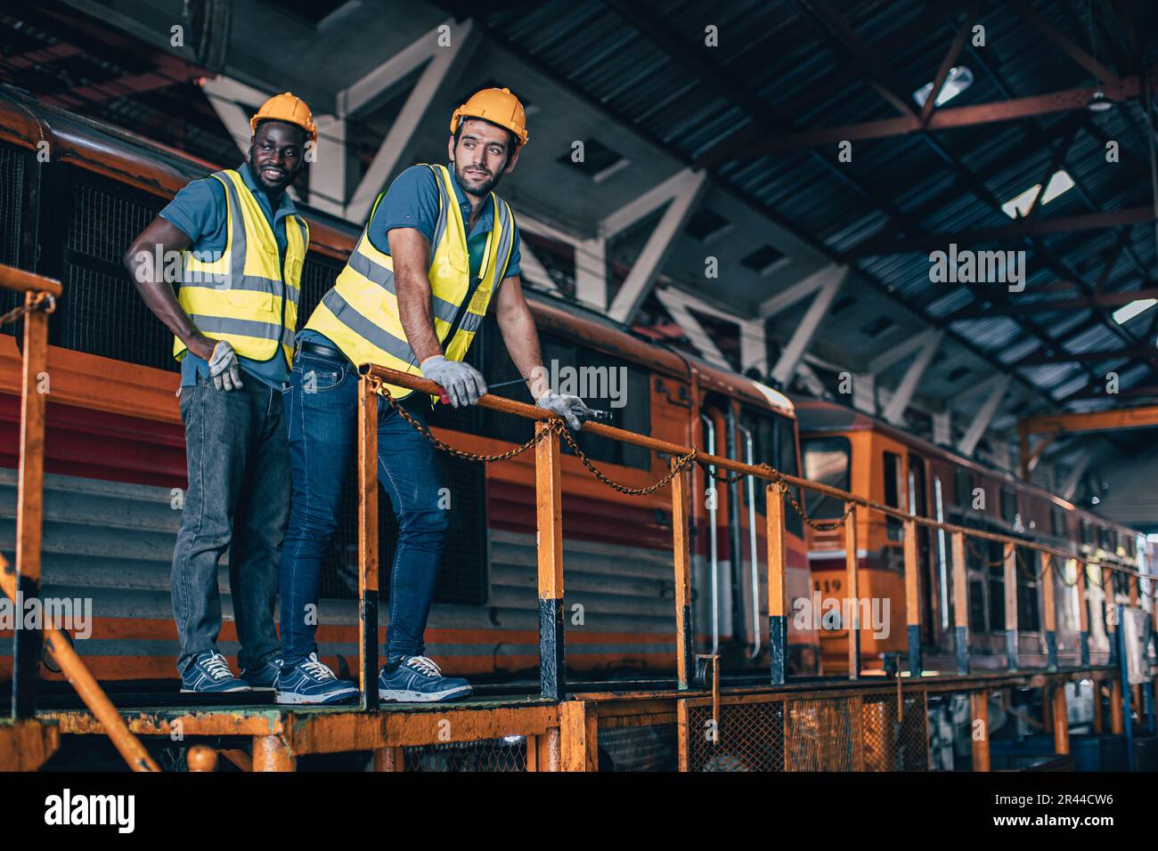 Engineer mechanic team workers standing relax in Diesel Locomotive ...