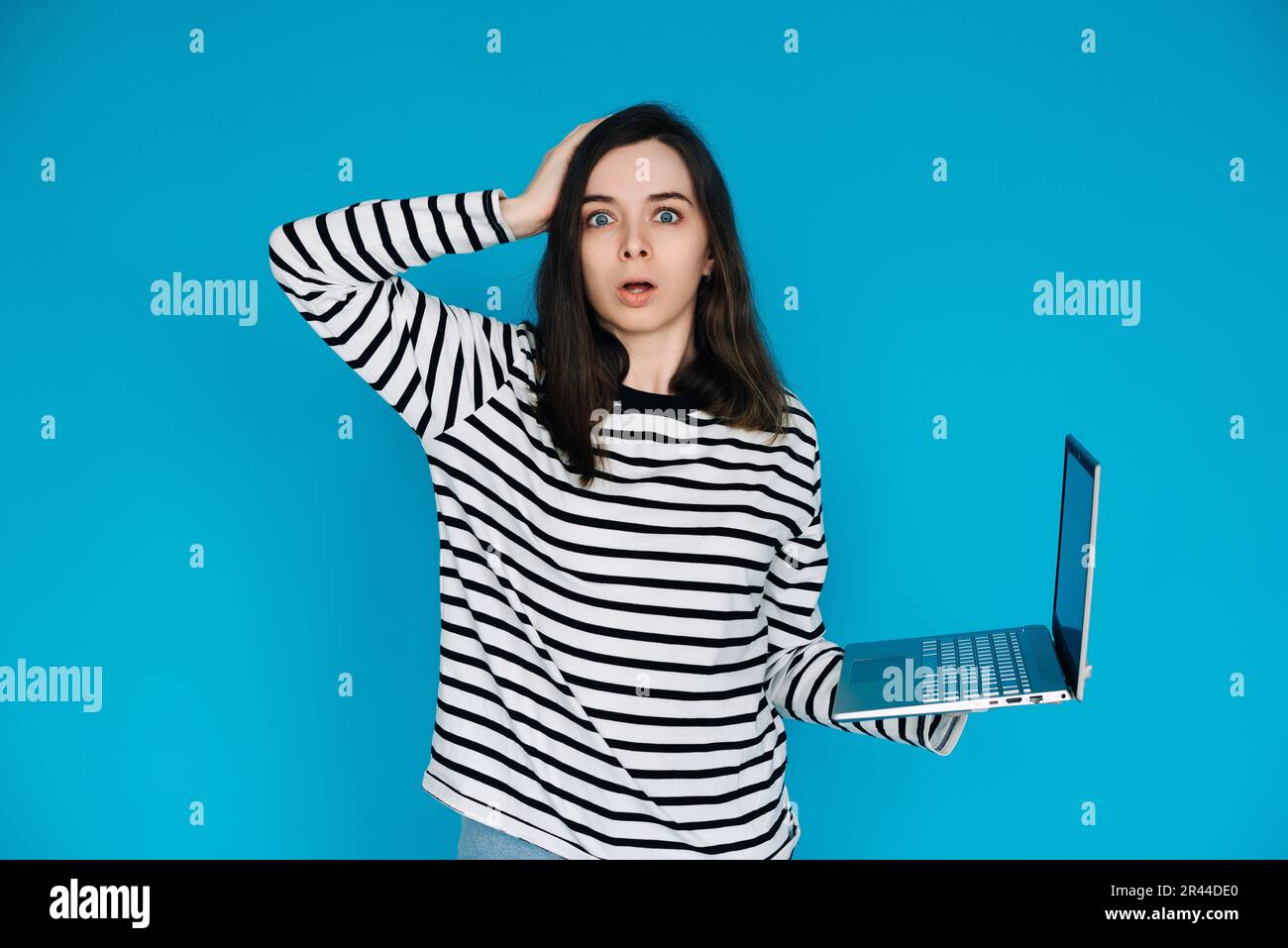 Emotional Young Woman in Striped Sweater Distraught by Bad News on ...