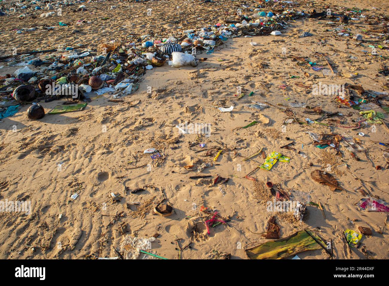 pile of garbage on the beach of the fishing area. Dirty sea, Black sand ...