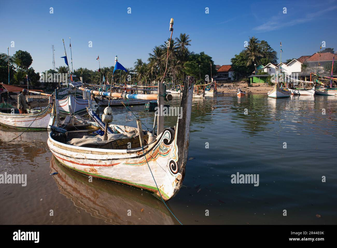 fishing boat anchored in the river Stock Photo - Alamy
