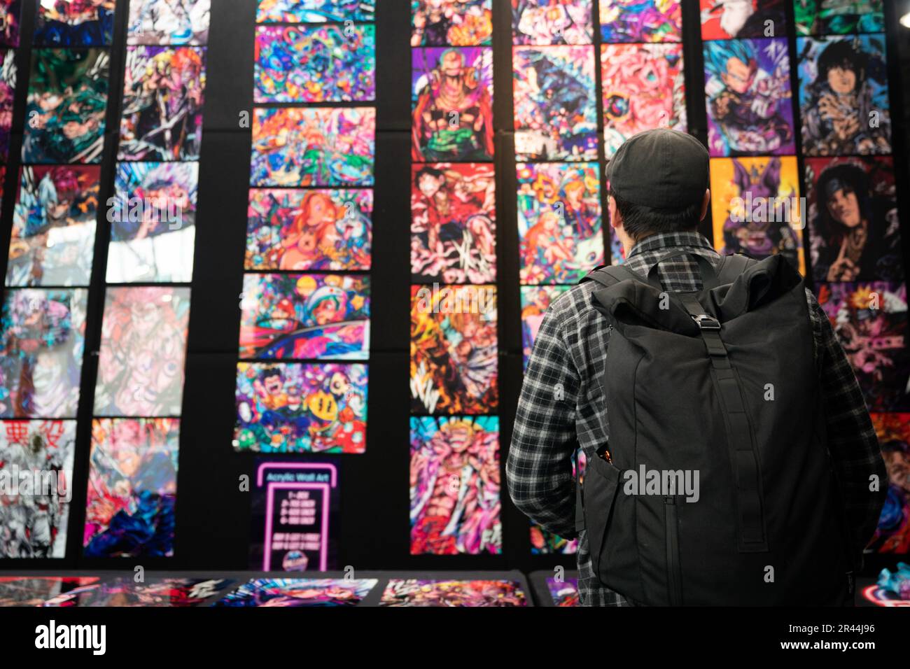 A man views posters during MCM Comic Con at the ExCel London in east ...