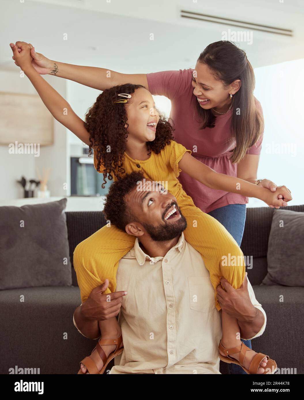 Family home, pretend airplane and kid with mom, dad and young girl ...